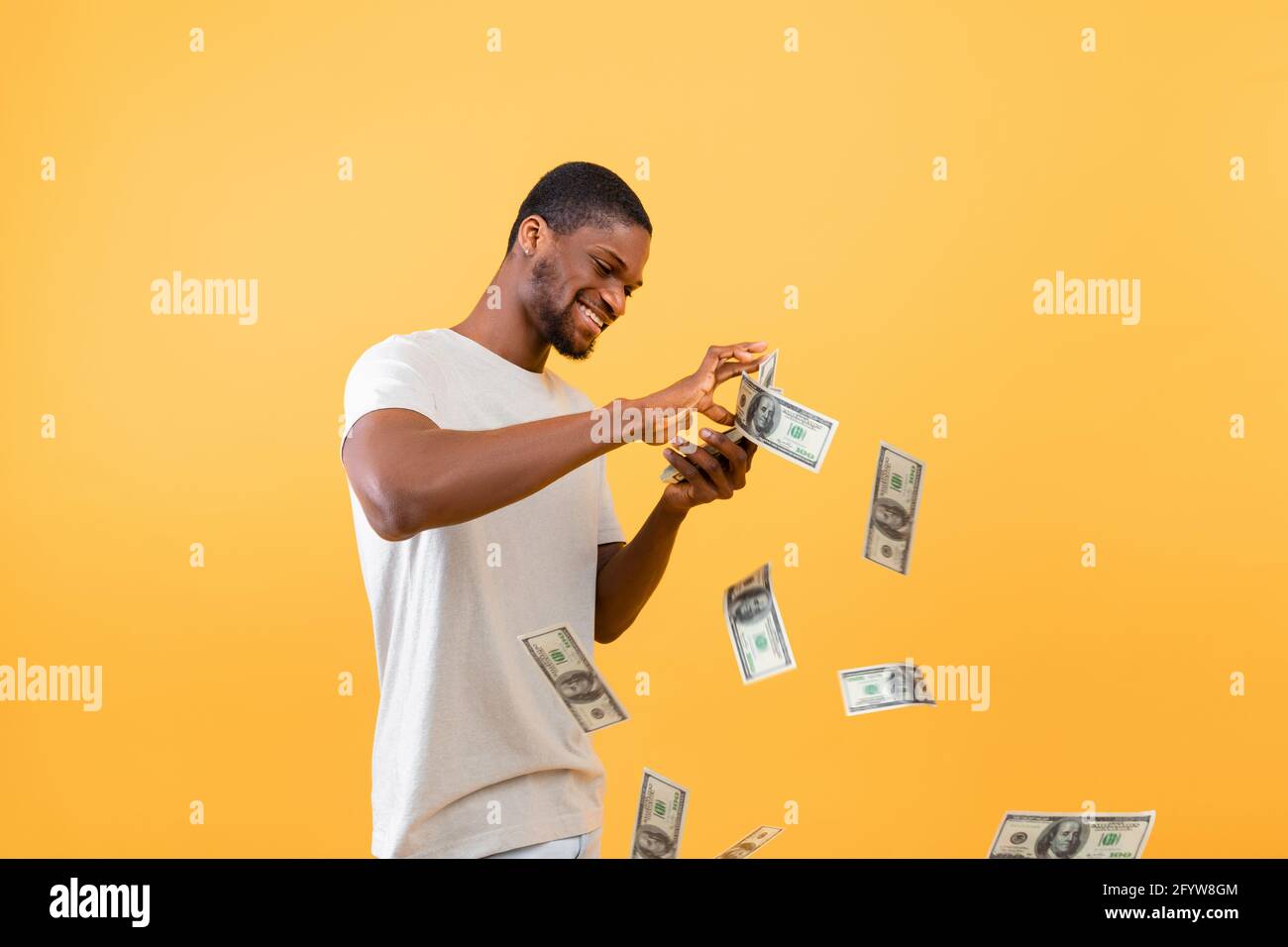 Happy rich man throwing money hi-res stock photography and images - Alamy