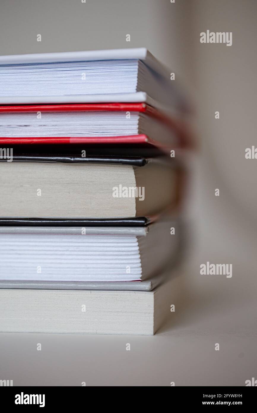 stack of different books with a side on a white background Stock Photo ...