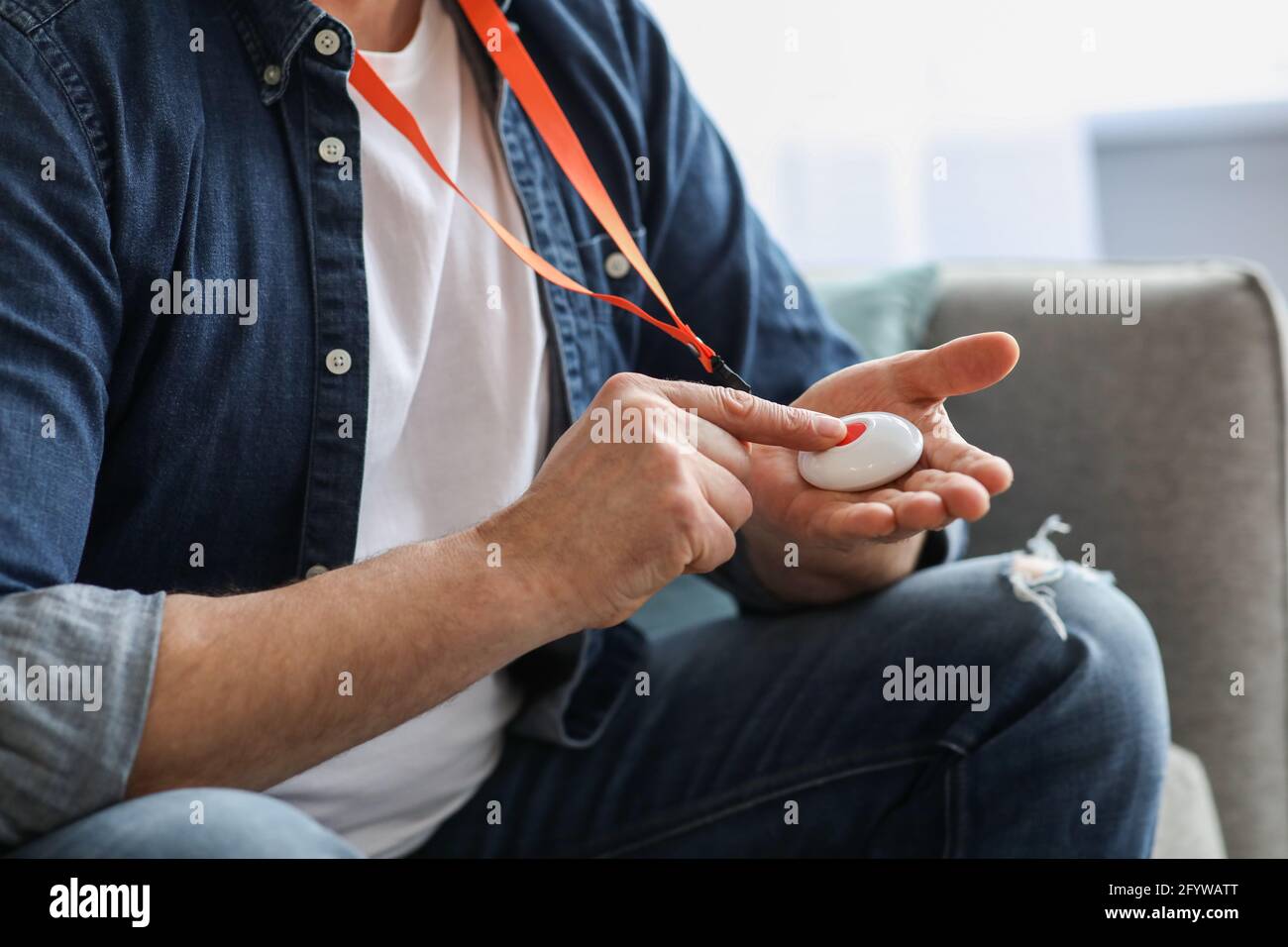 Hand pushing panic button on emergency equipment for old people Stock ...