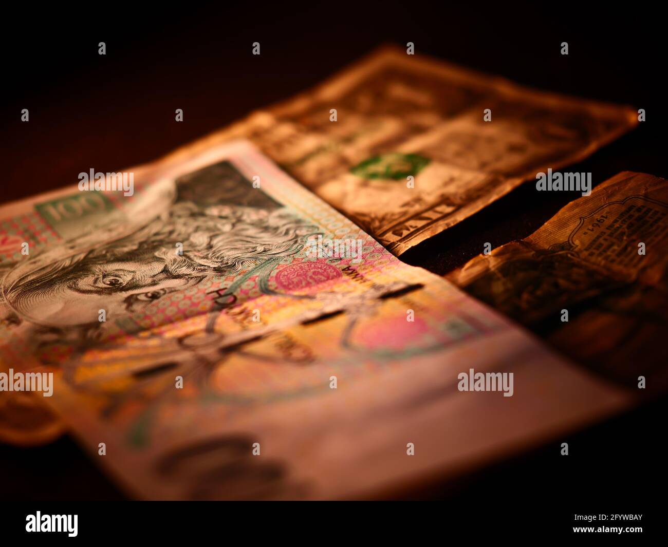 A closeup shot of Czech money with dollars on a blurred background ...