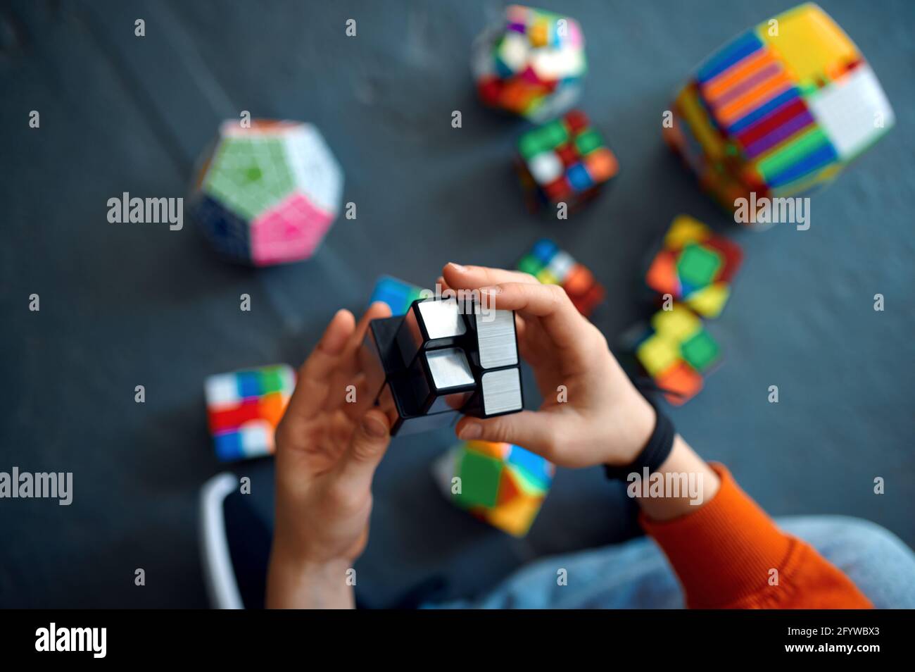 Male child play with puzzle cubes Stock Photo - Alamy