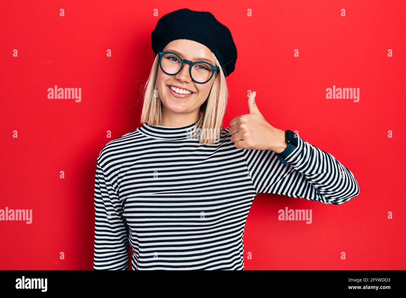 Beautiful blonde woman wearing french look with beret an glasses ...