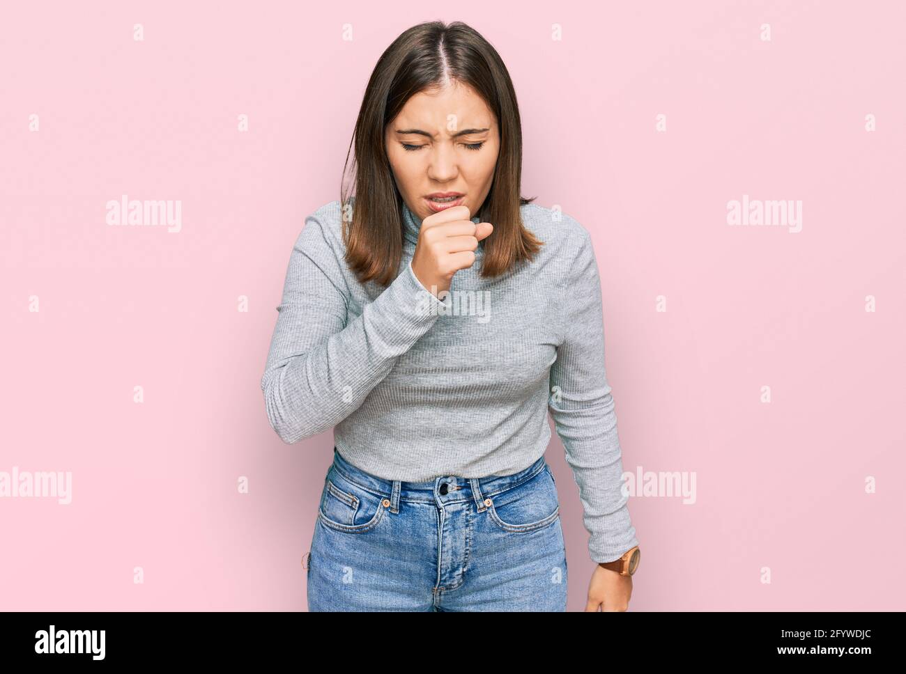 Young beautiful woman wearing casual turtleneck sweater feeling unwell ...
