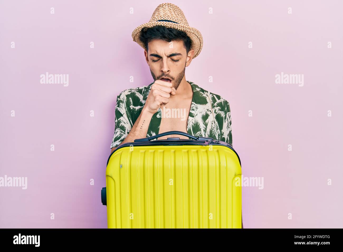 Young hispanic man wearing summer style and holding cabin bag feeling ...