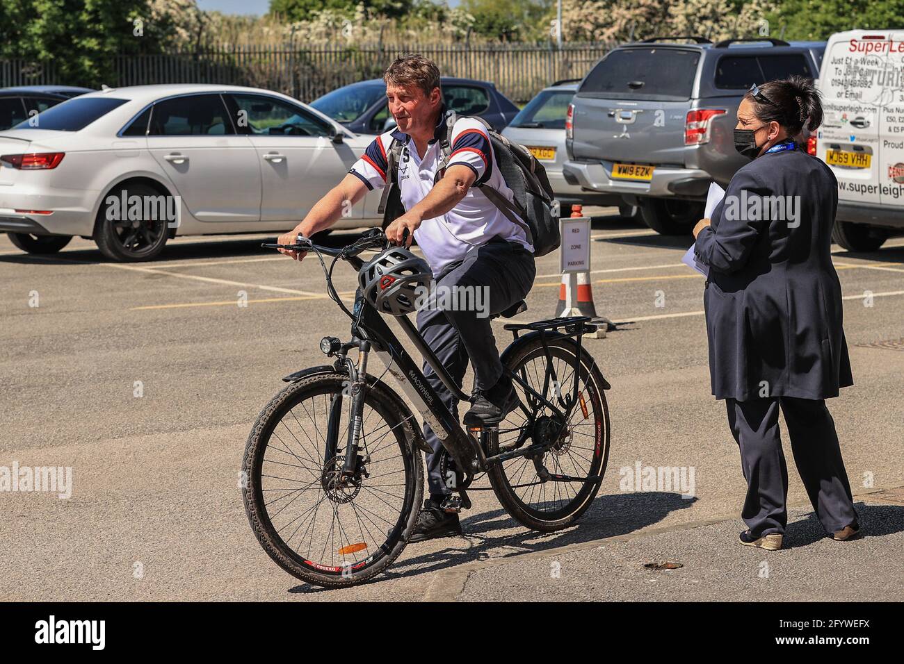 Tony Smith Head Coach of Hull KR arrives at Hull College Craven Park on his electric bike Stock ...
