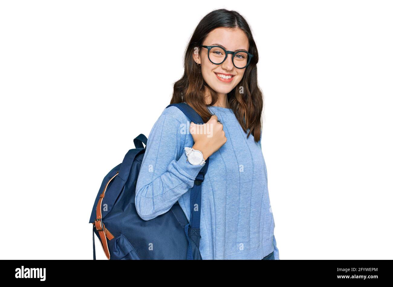 Young beautiful girl wearing student backpack looking positive and ...
