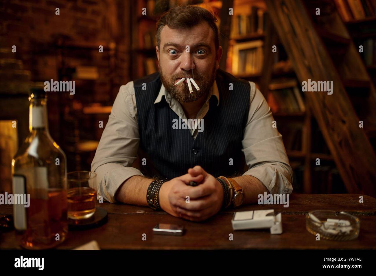 Crazy man smokes three cigarettes at the same time Stock Photo - Alamy
