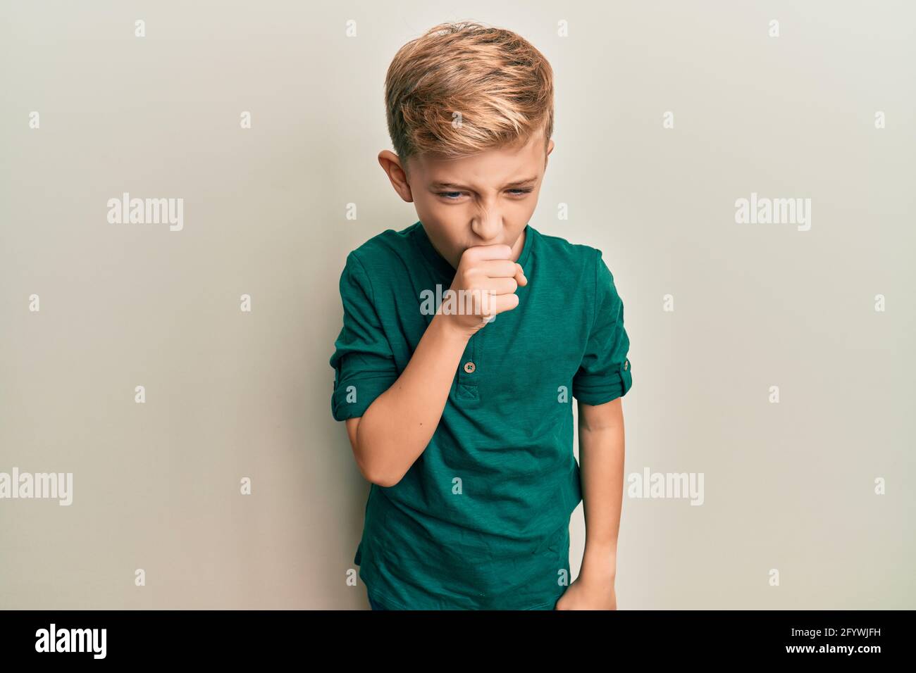 Little caucasian boy kid wearing casual clothes feeling unwell and ...