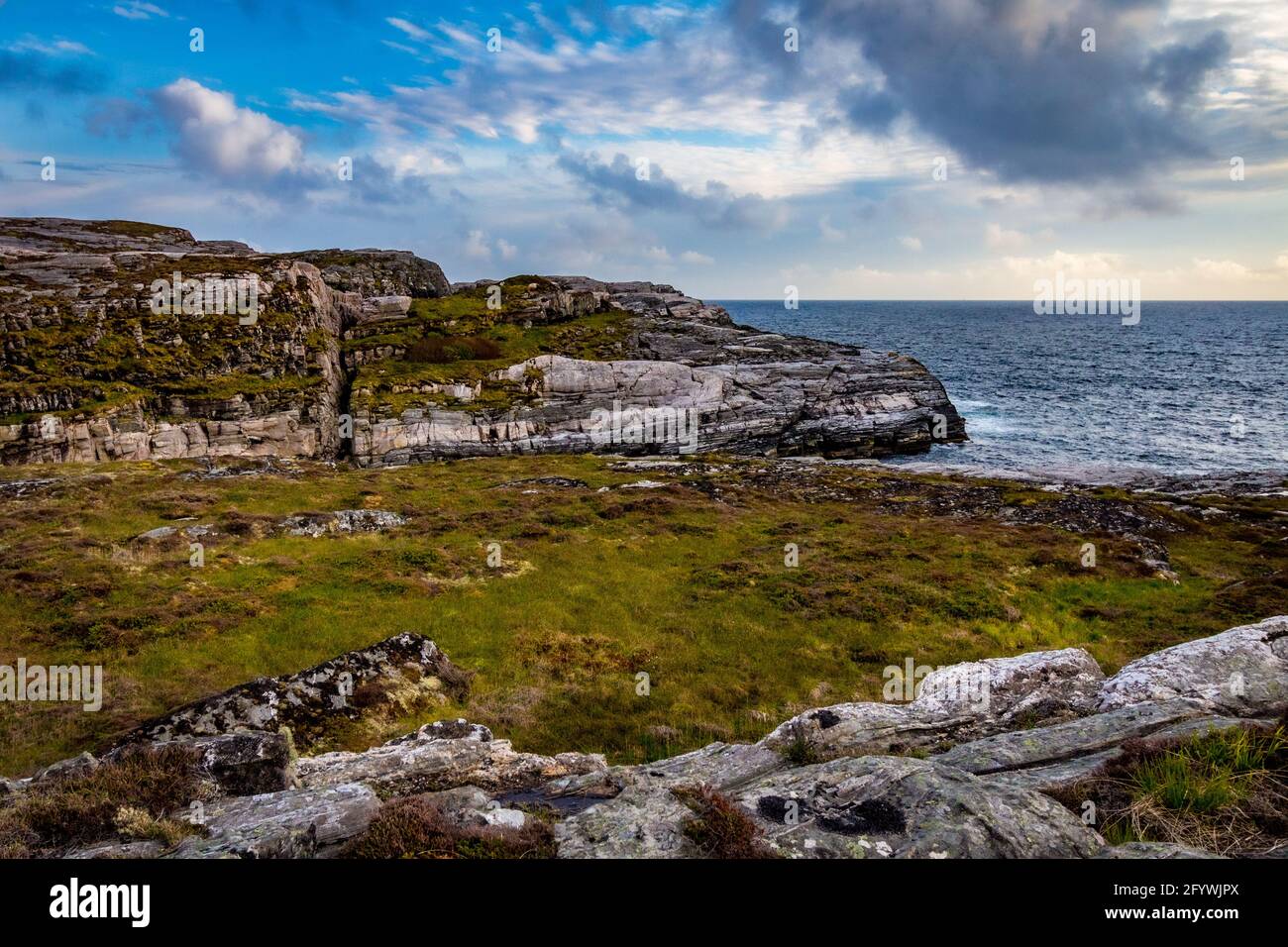 The scenic view of the cliffs by the ocean Stock Photo - Alamy
