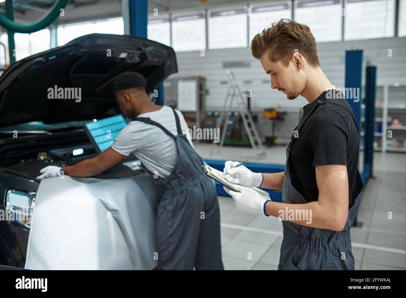 Mechanic repairs car service station hi-res stock photography and ...