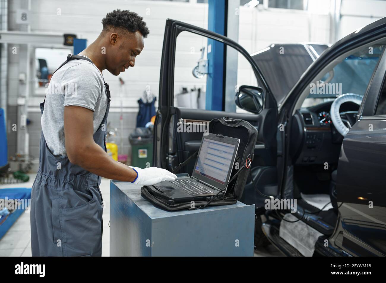 Professional auto mechanic using wrench hi-res stock photography and ...