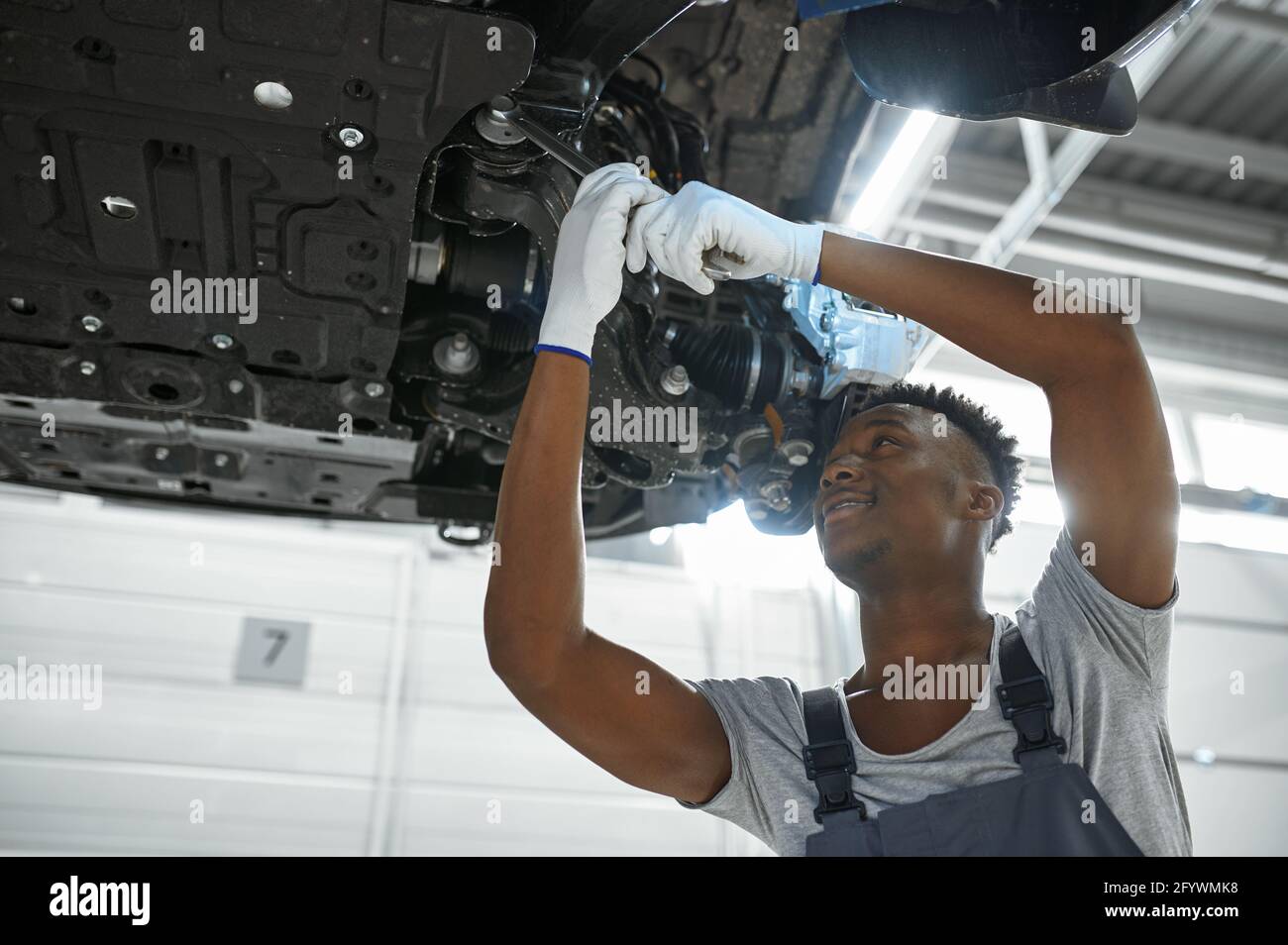 Male working car engine transportation automotive repairs hi-res stock ...