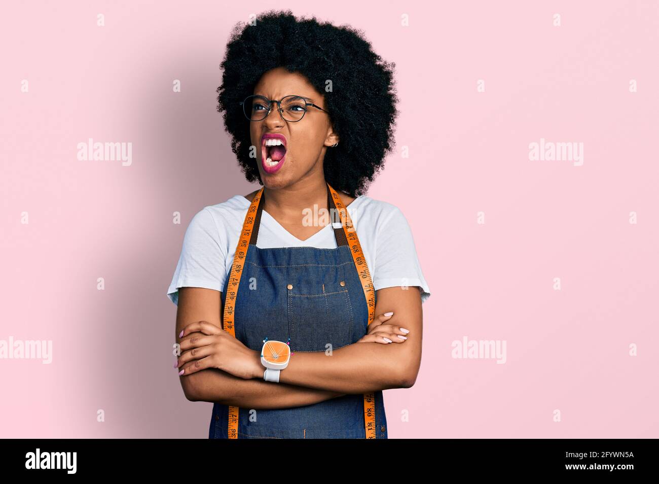Young african american woman dressmaker designer wearing atelier apron ...