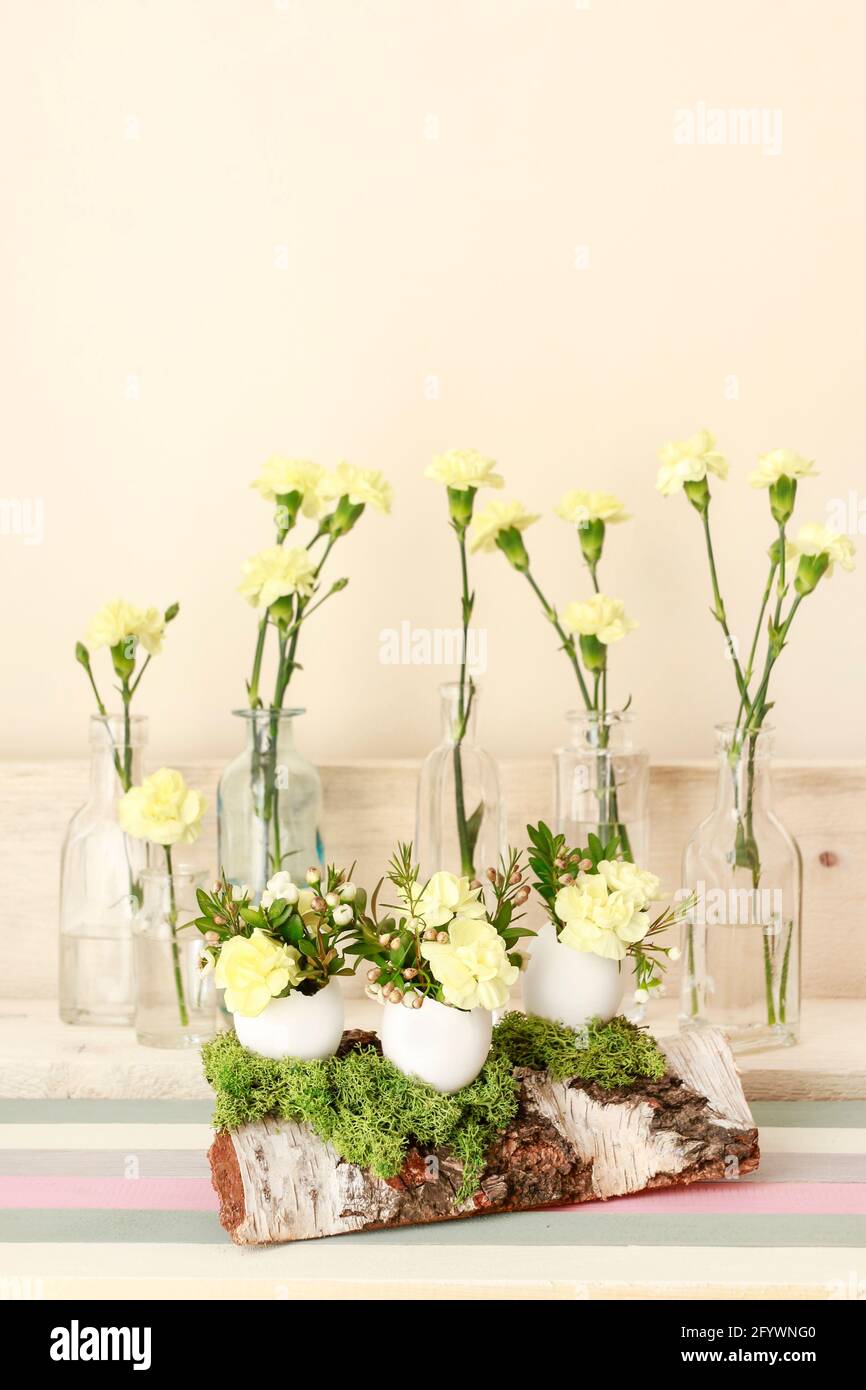 Easter decoration with egg shell, carnation flower, buxus, chamelaucium ...