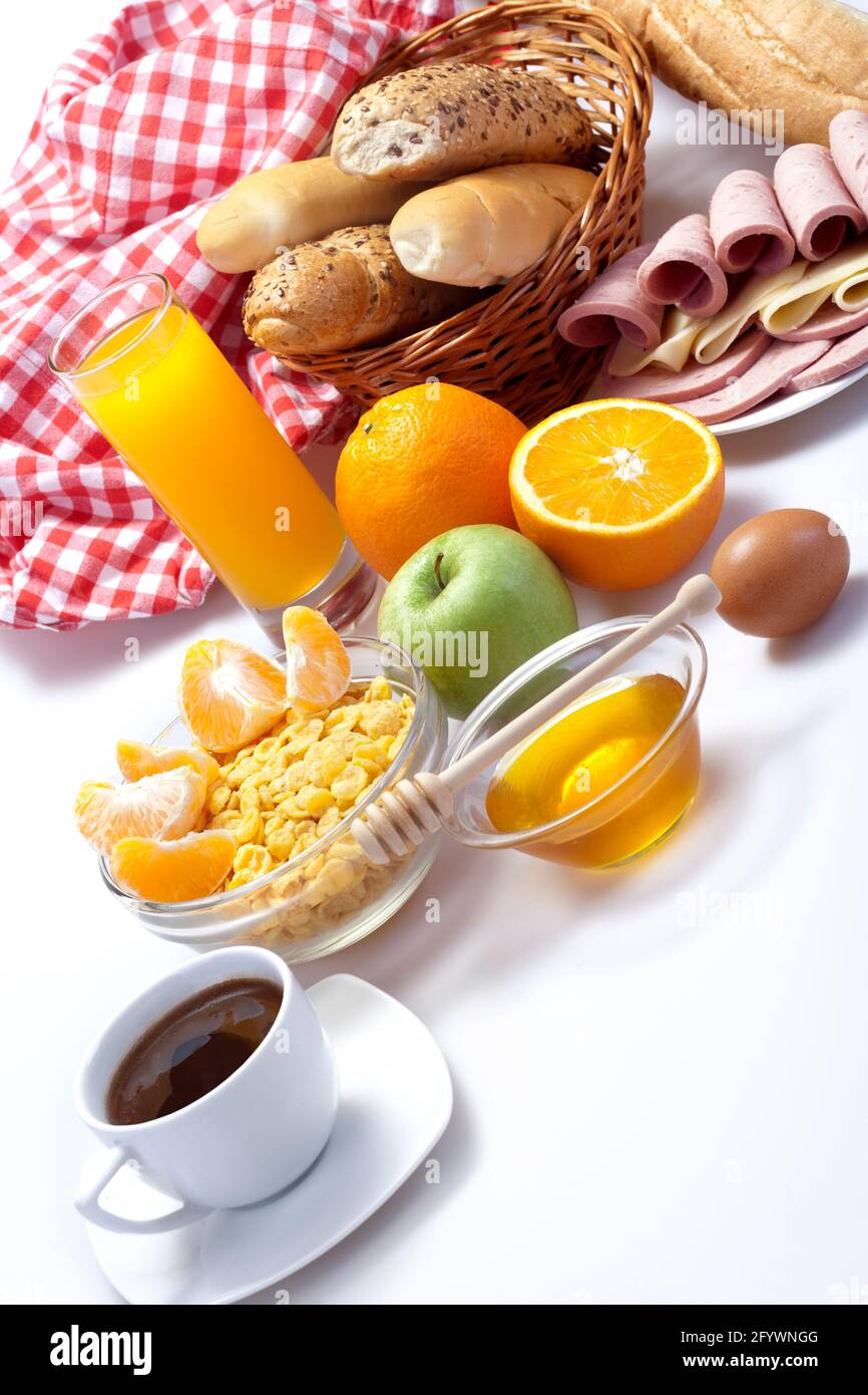 Homemade breakfast with fruits and orange juice on the white background ...