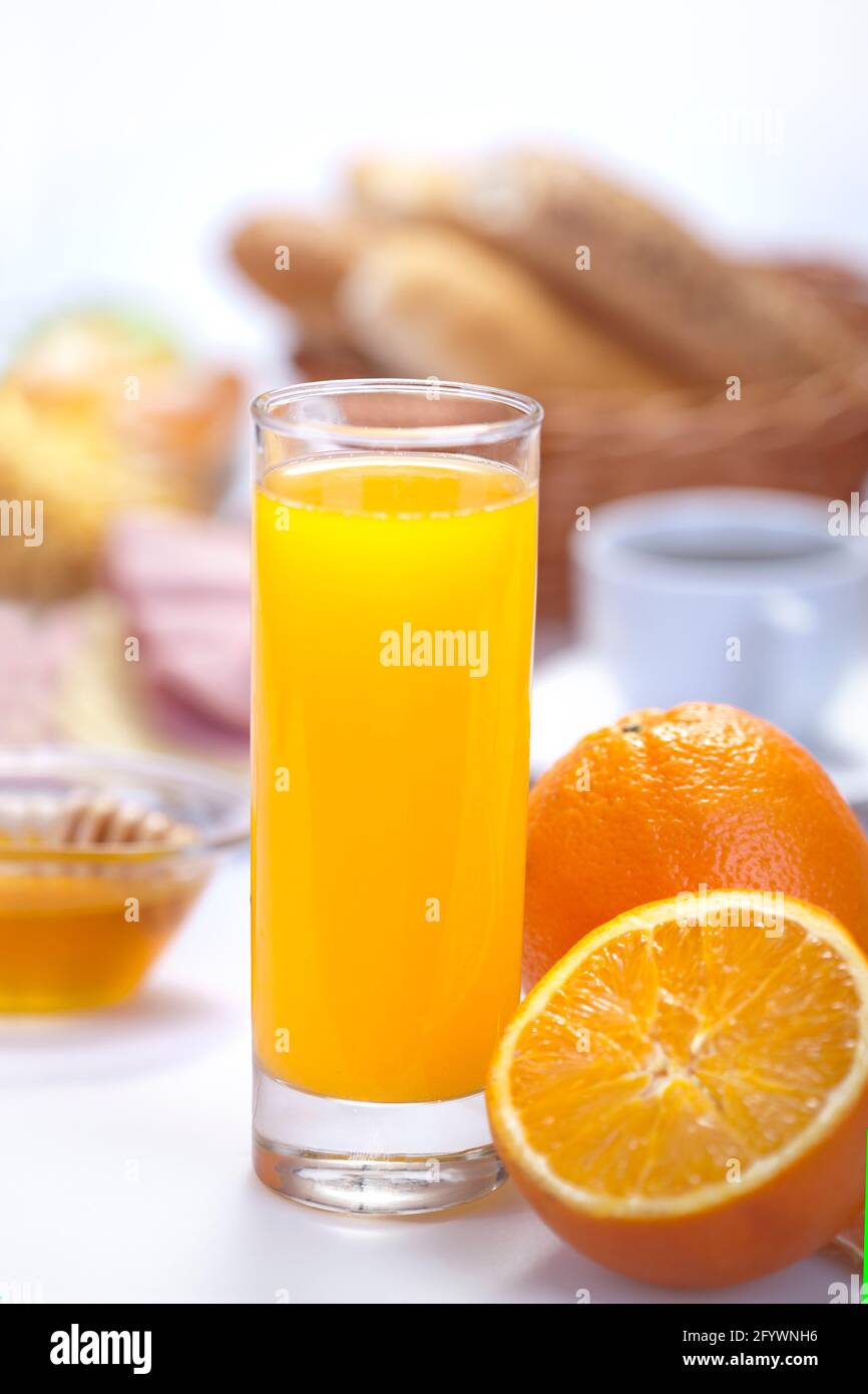 Homemade breakfast with fruits and orange juice on the white background ...