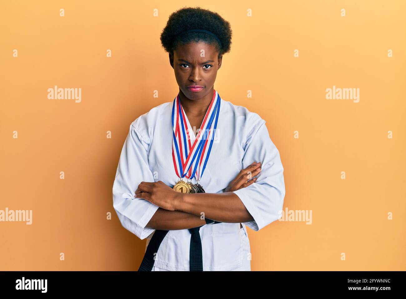 Young african american girl wearing karate kimono and black belt ...