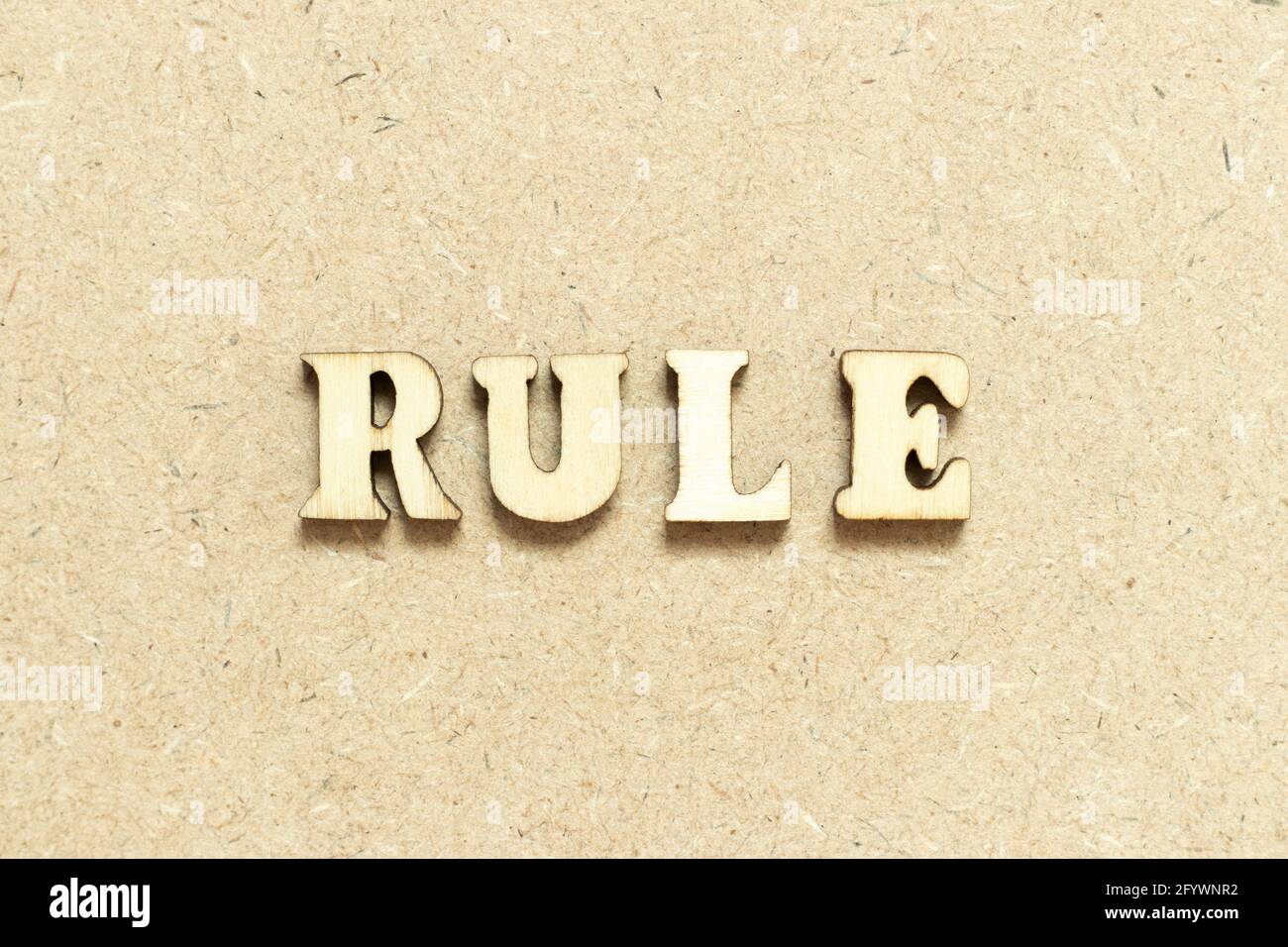 Alphabet letter in word rule on wood background Stock Photo - Alamy