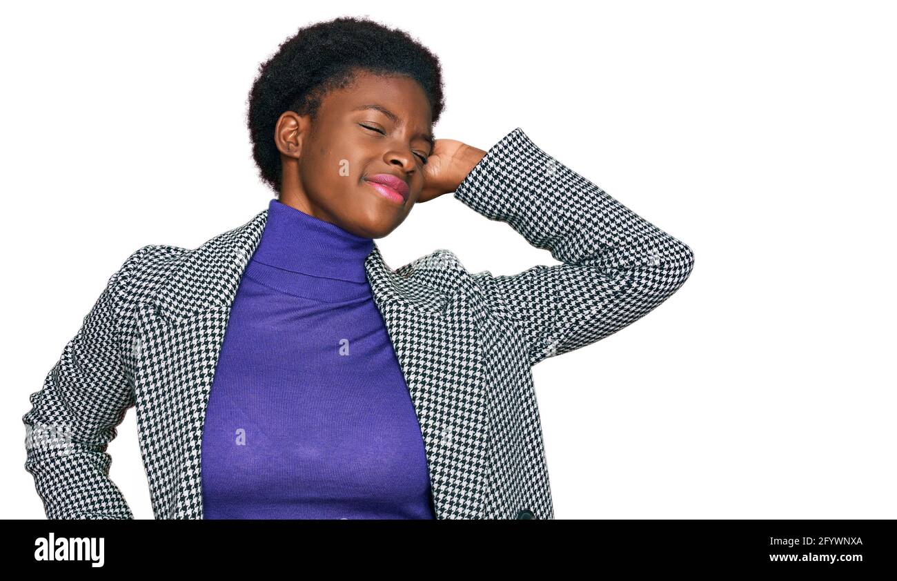 Young african american girl wearing casual clothes suffering of neck ...
