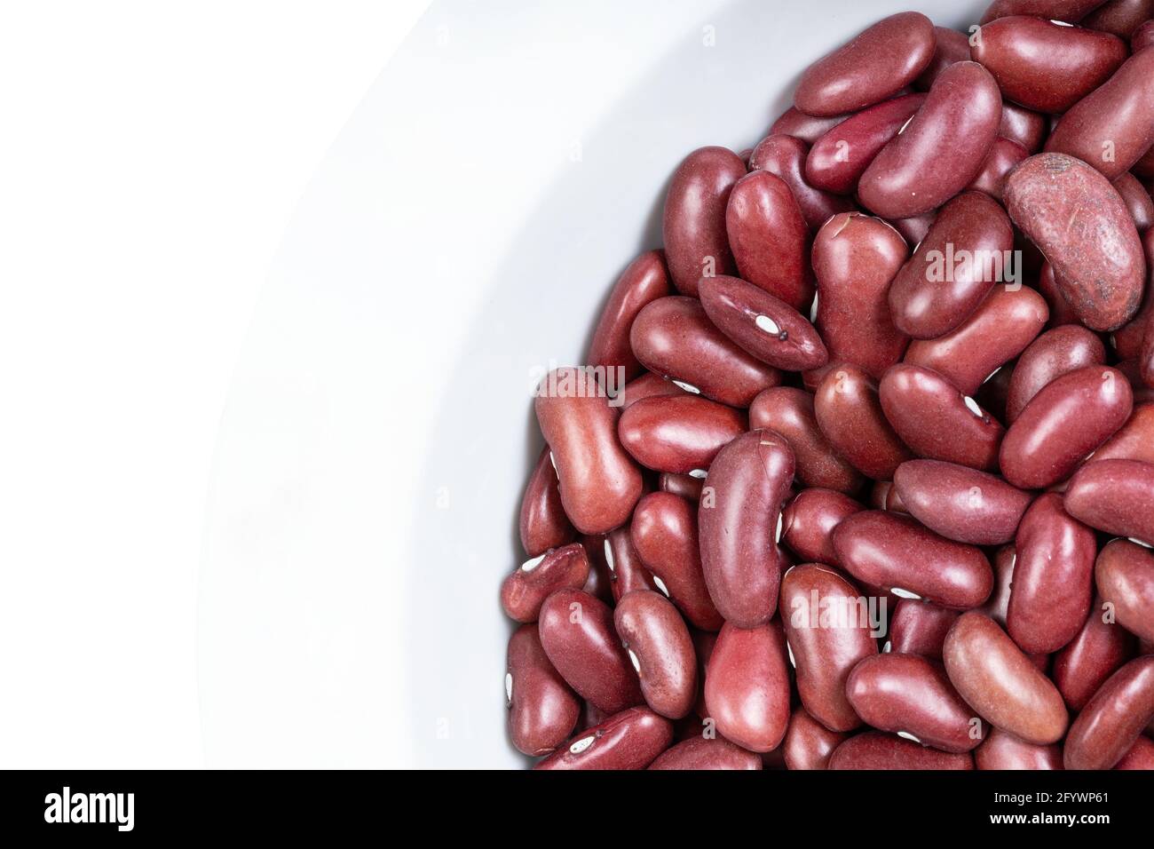 top view of part of round bowl with kidney beans isolated on white ...