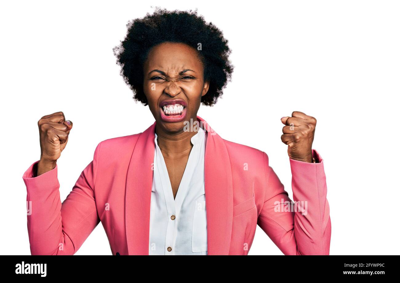 African american woman with afro hair wearing business jacket angry and ...