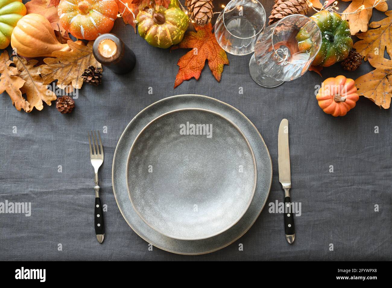 Autumn and Thanksgiving day table setting with empty plate as mockup ...