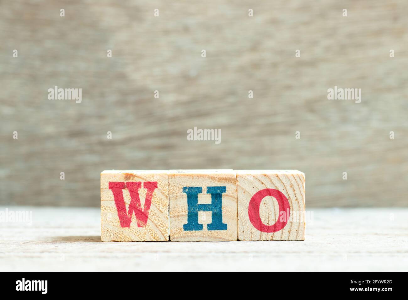 Alphabet letter block in word who on wood background Stock Photo - Alamy