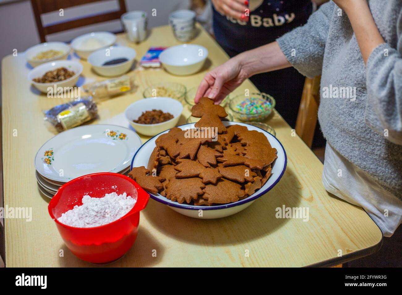 Female taking gingerbread cookie hi-res stock photography and images ...