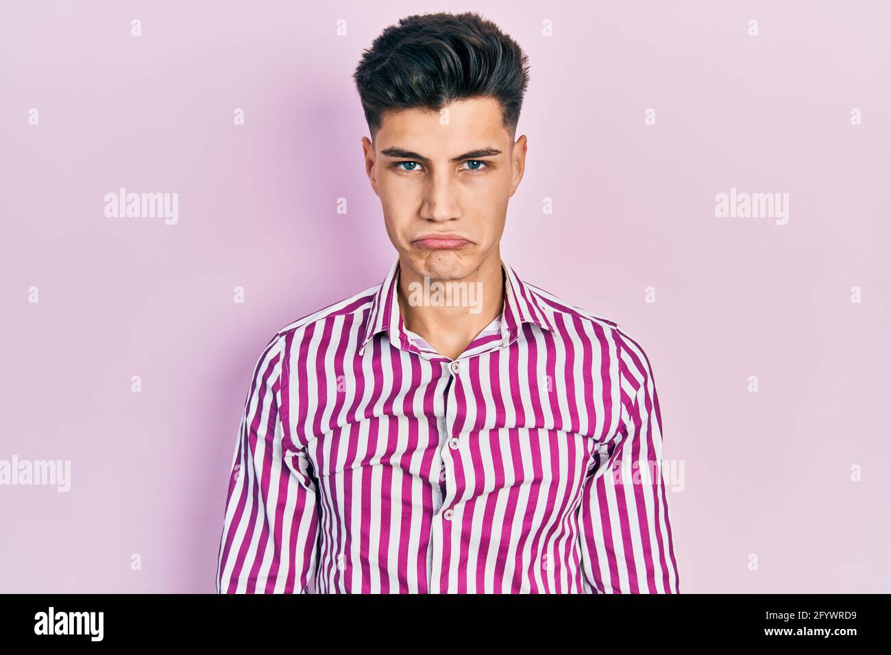 Young hispanic man wearing casual clothes depressed and worry for ...