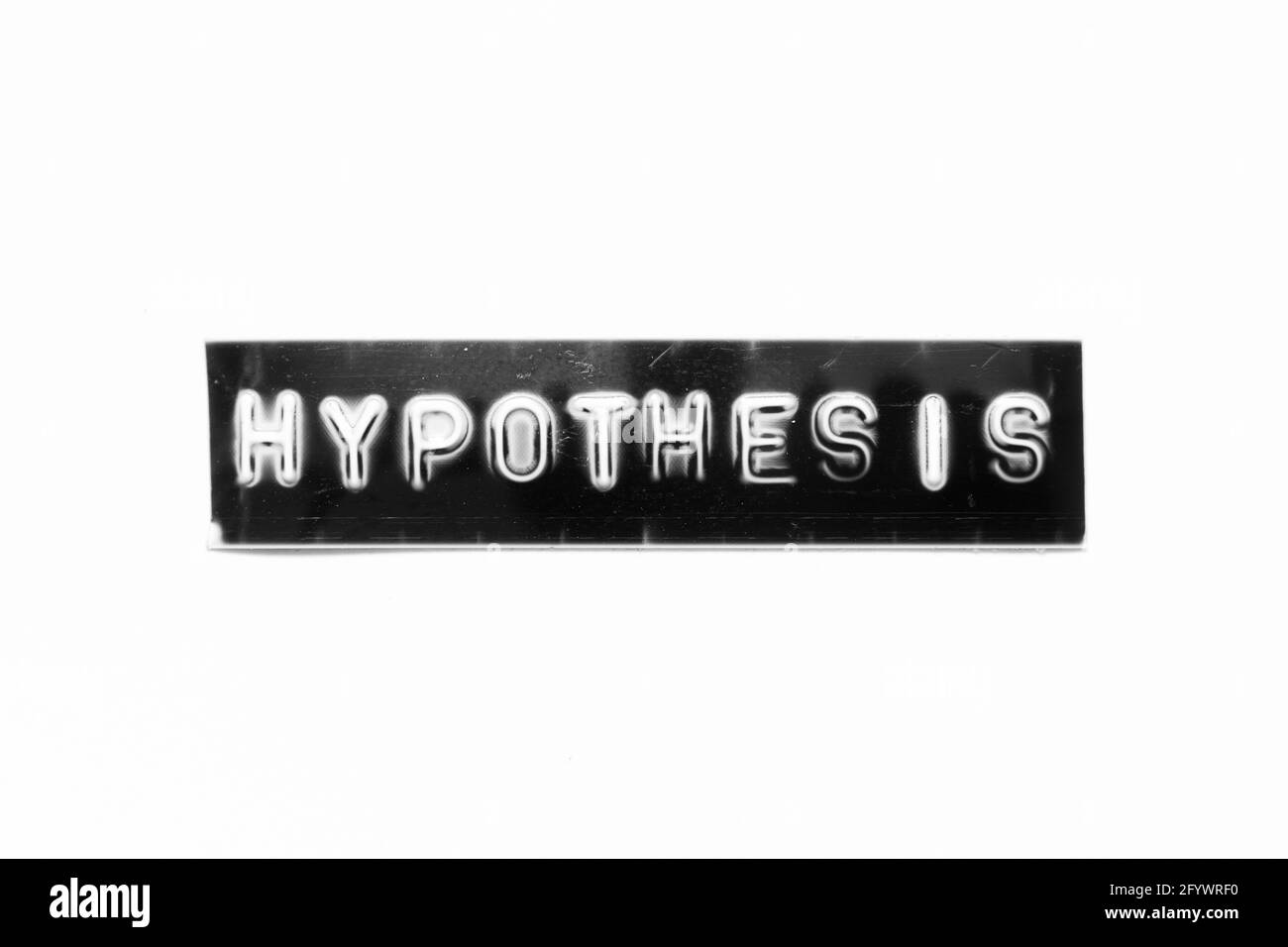Embossed letter with word hypothesis in black banner on white paper ...