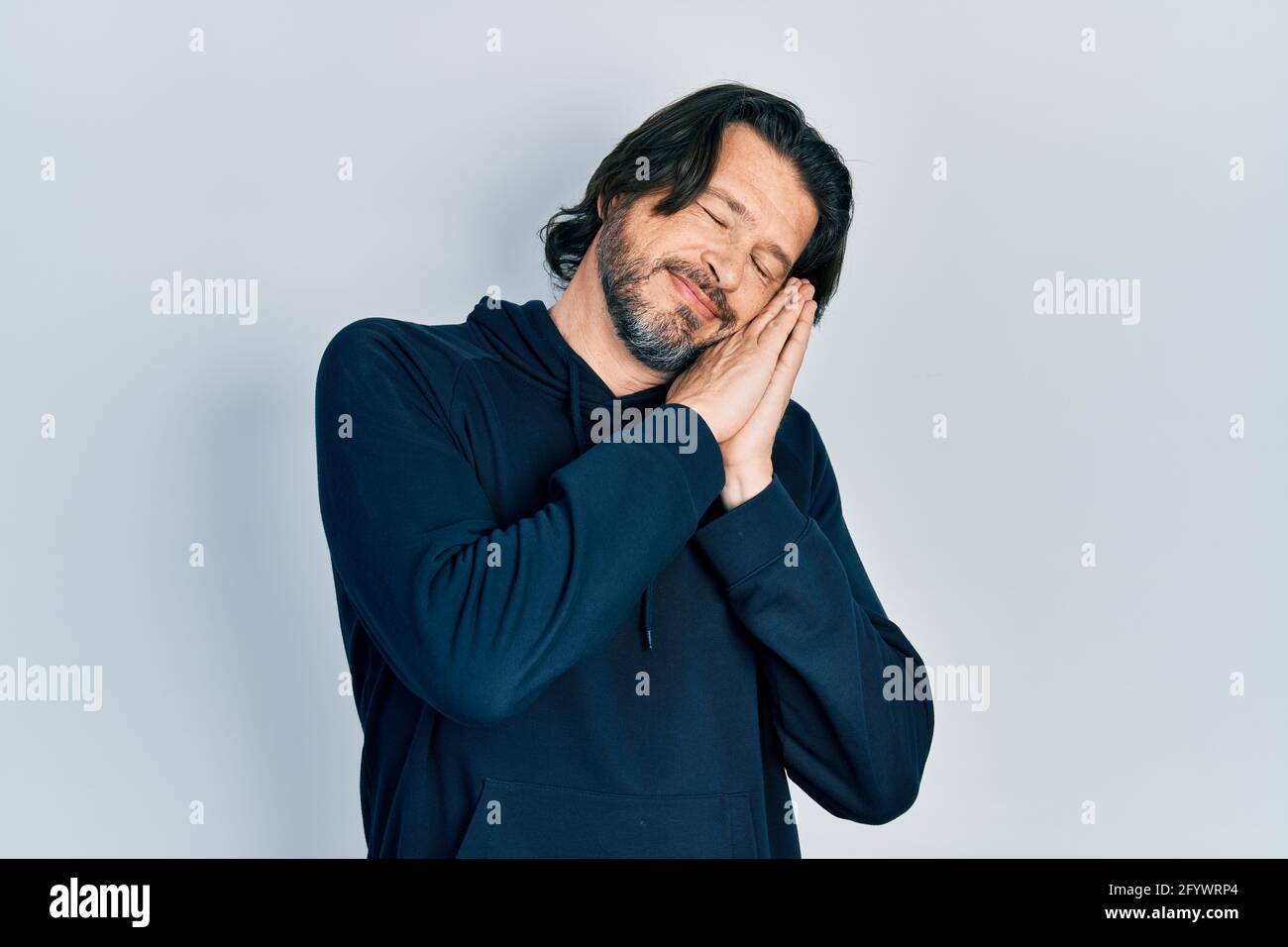 Middle age caucasian man wearing casual sweatshirt sleeping tired ...