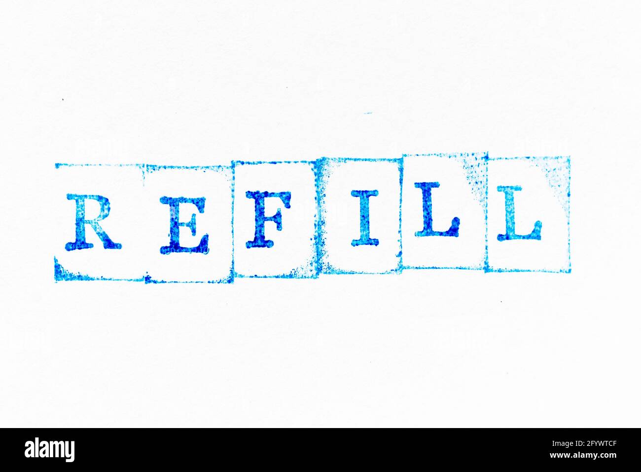 Blue color ink rubber stamp in word refill on white paper background ...