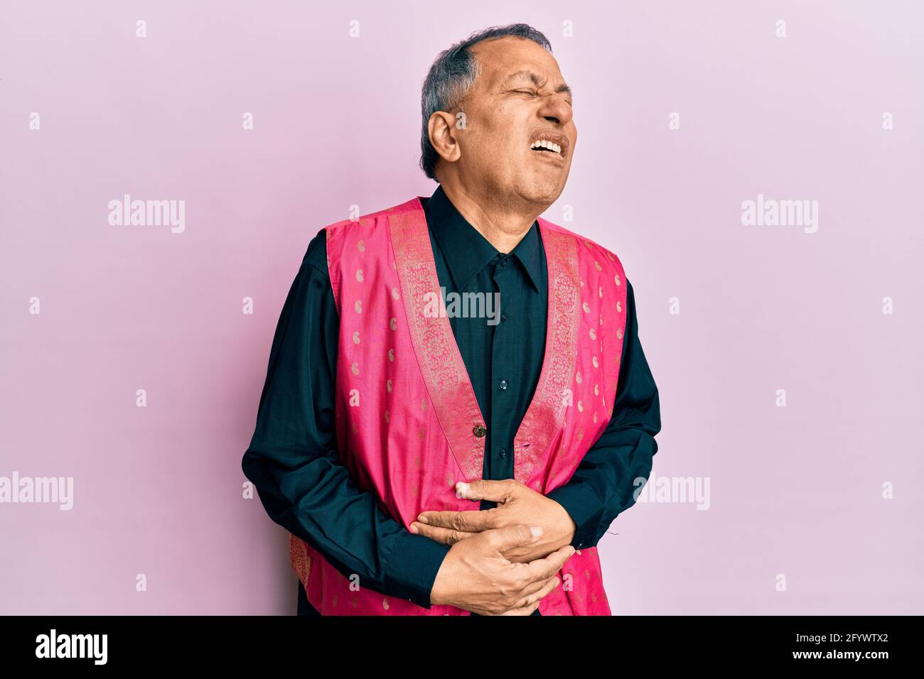 Middle age indian man wearing traditional indian clothes with hand on ...