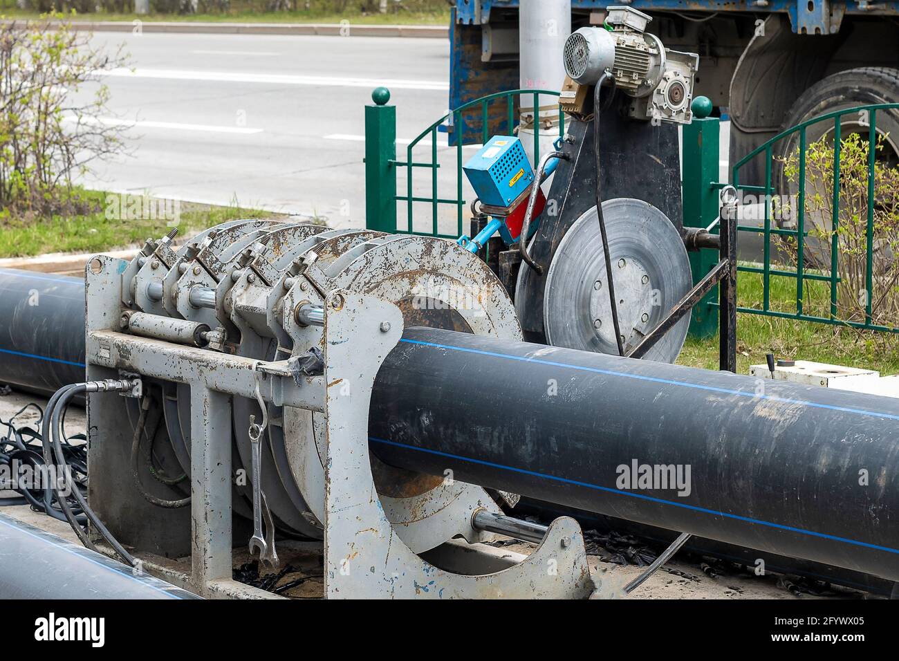 Industrial soldering iron for large PVC pipes. Day in city, horizontal ...