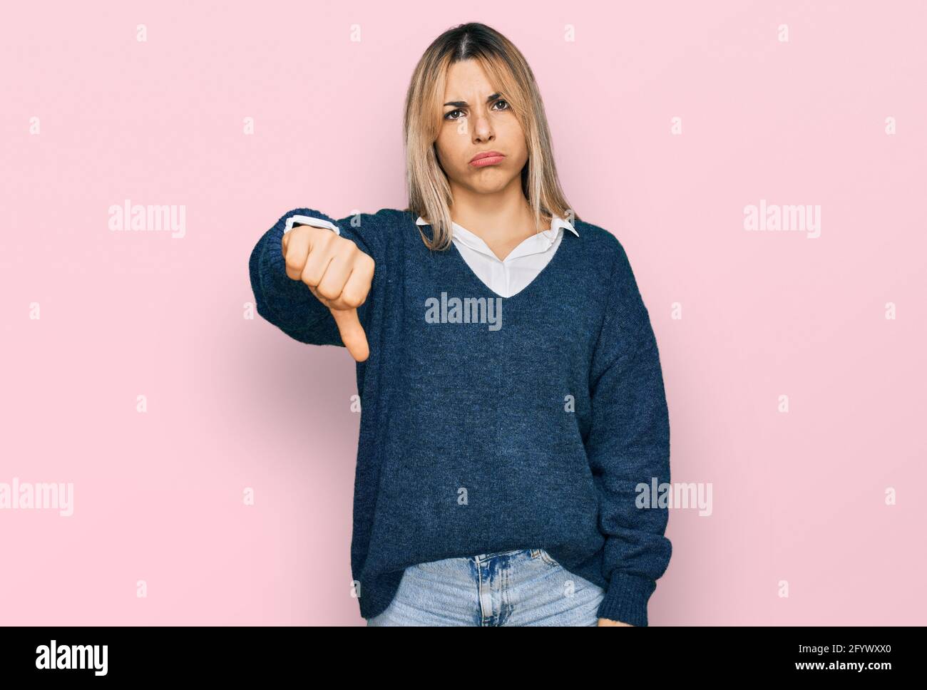 Young caucasian woman wearing casual clothes looking unhappy and angry ...