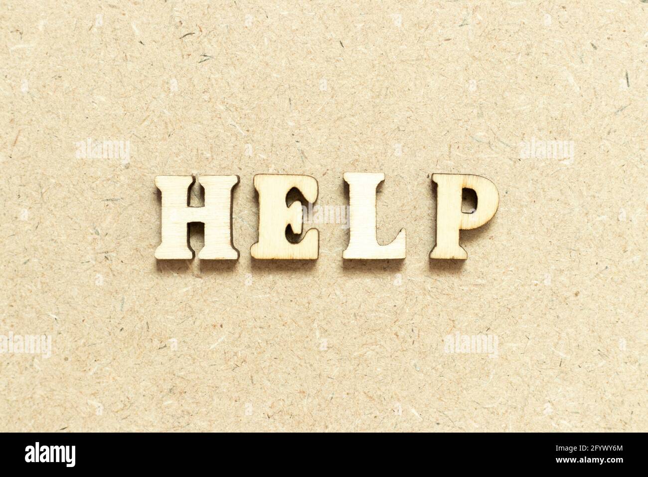 Alphabet letter in word help on wood background Stock Photo - Alamy
