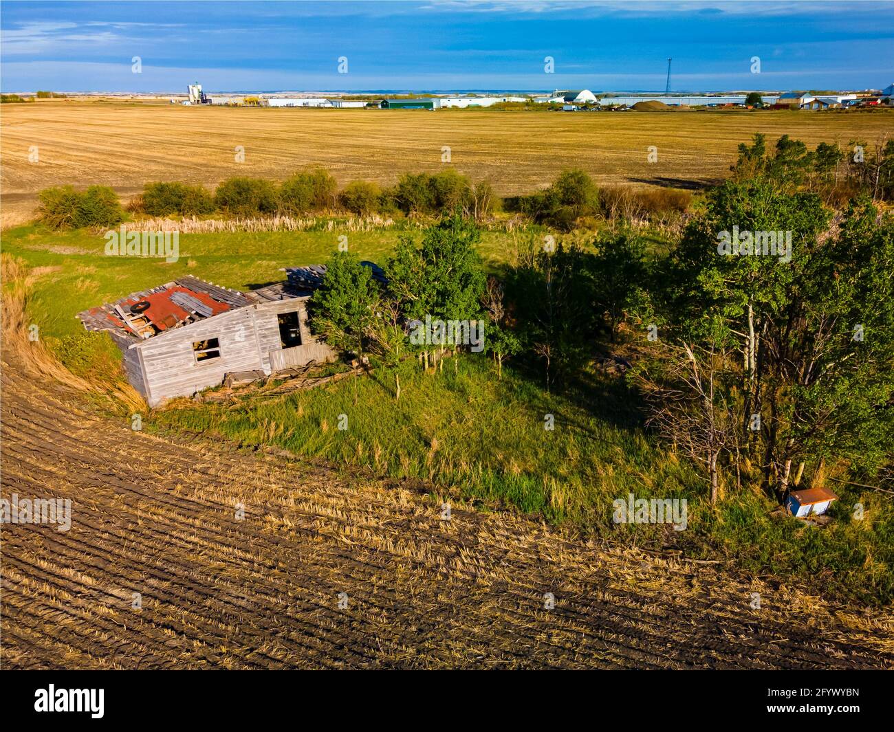Aerial view of old abandoned farm houses that were left to be reclaimed ...