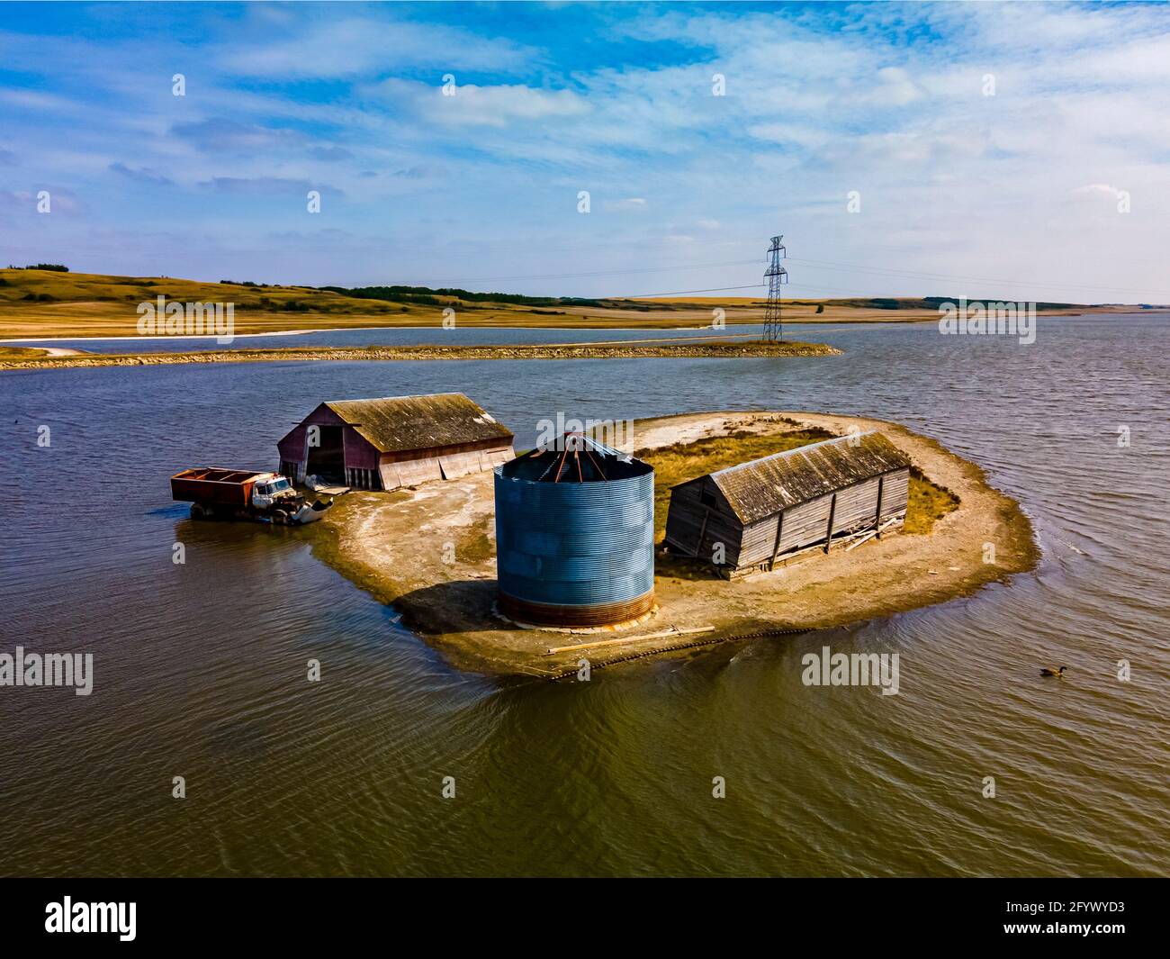 Aerial view of old abandoned farm houses that were left to be reclaimed ...