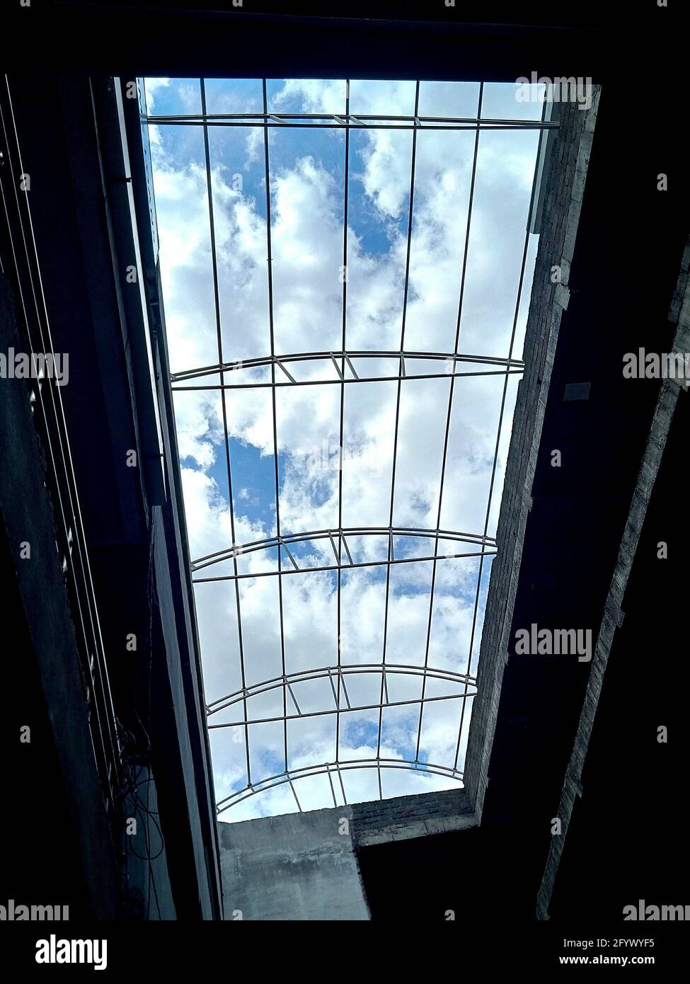 A vertical shot of a window on the roof under a bright sky Stock Photo ...