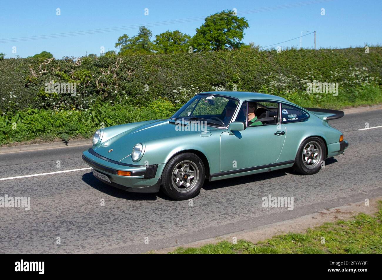 1975 70s green Porsche 911; 2700cc roadster, traffic, moving vehicles ...