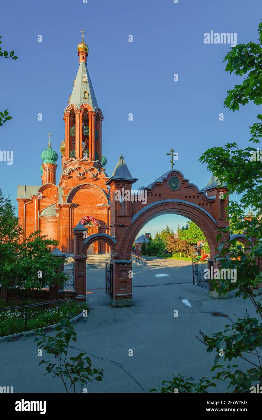 Red brick Orthodox church with an arch gate Stock Photo - Alamy