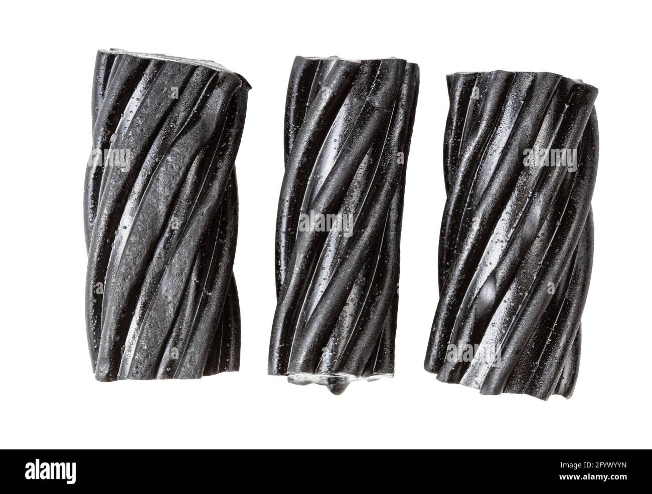 few coiled black licorice candies isolated on white background Stock ...