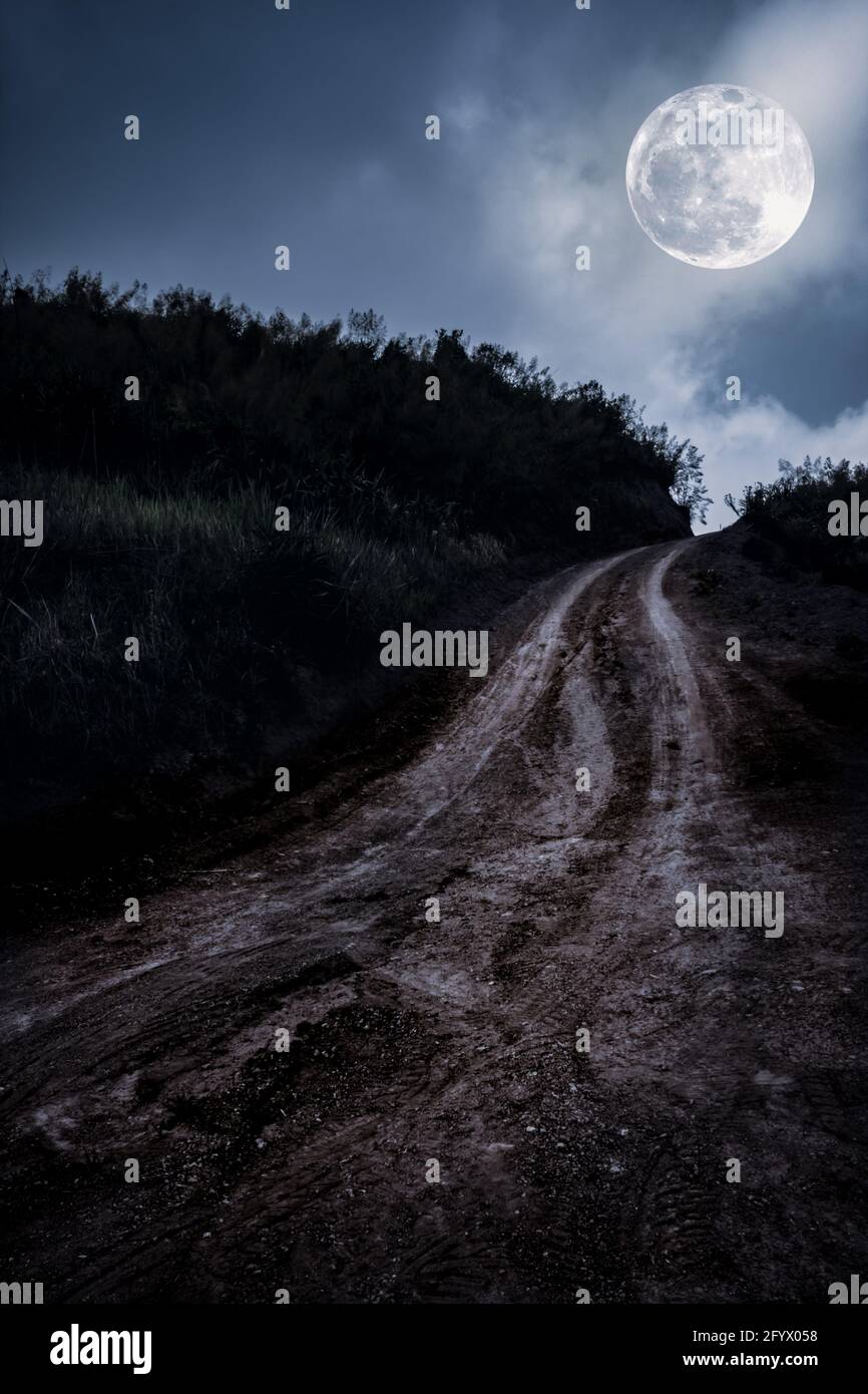 Landscape in nature of beautiful full moon with tire tracks on a muddy ...