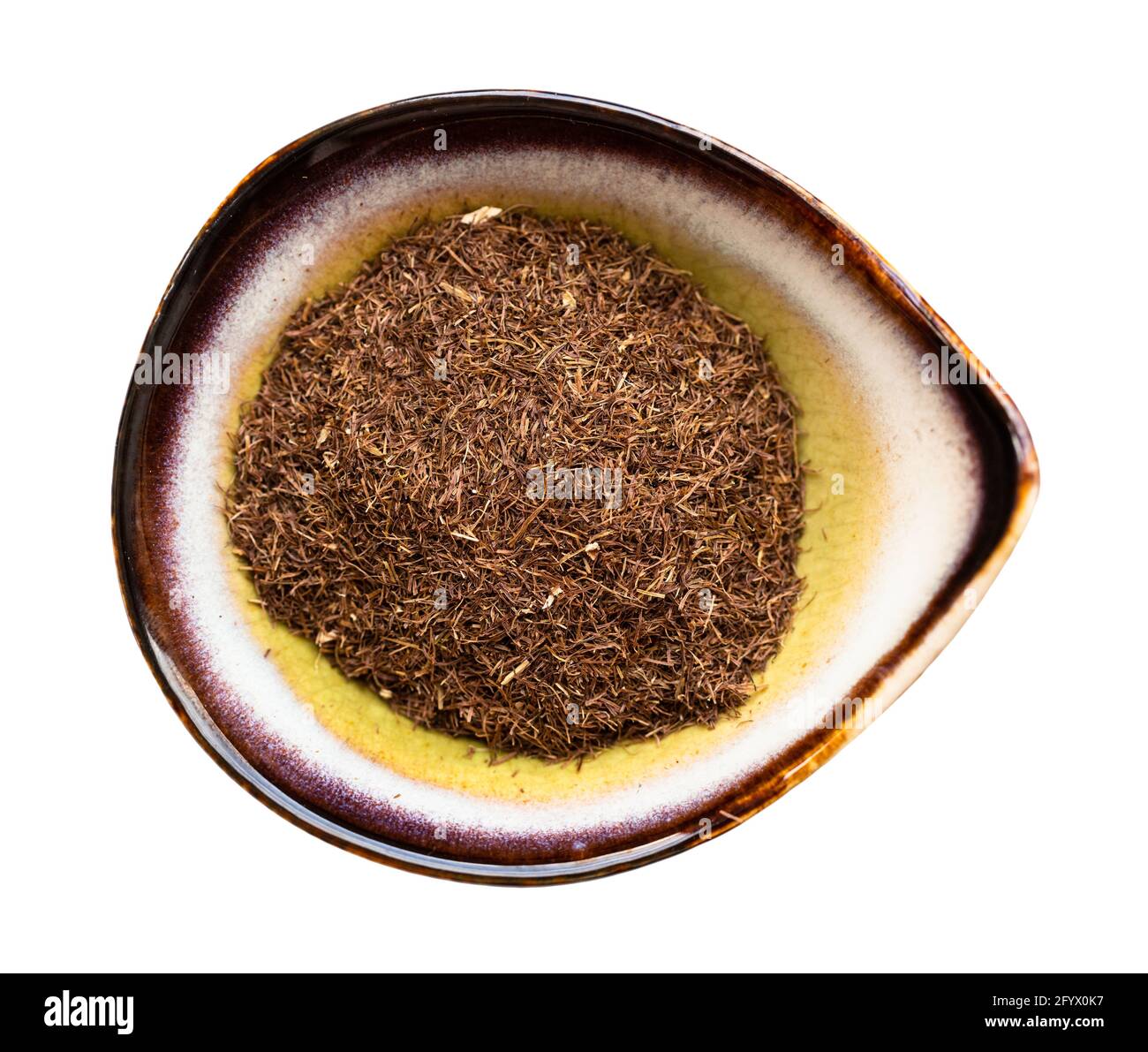top view of grinded dried corn silk in ceramic bowl isolated on white ...