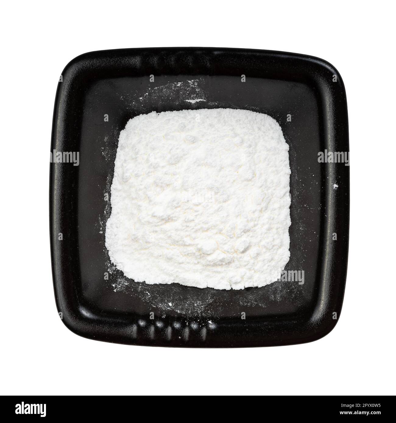 top view of baking powder in black bowl isolated on white background ...