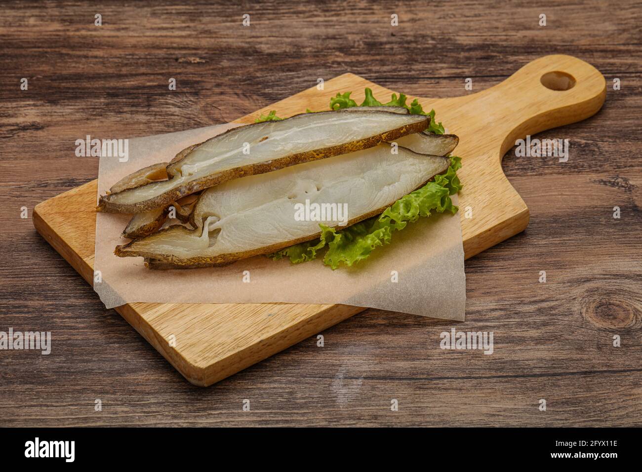 Delicous smoked halibut fish slices snack Stock Photo - Alamy