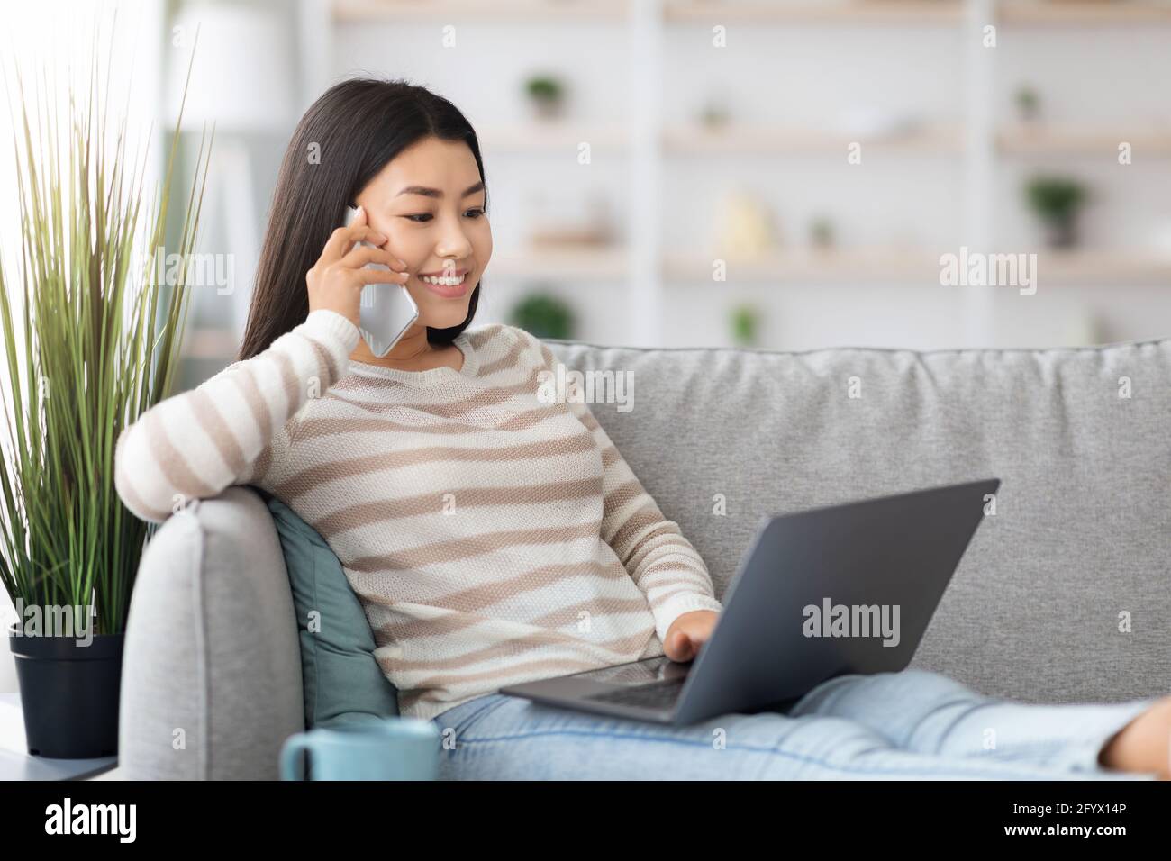 Home Office. Happy Young Asian Freelancer Lady Using Cellphone And ...
