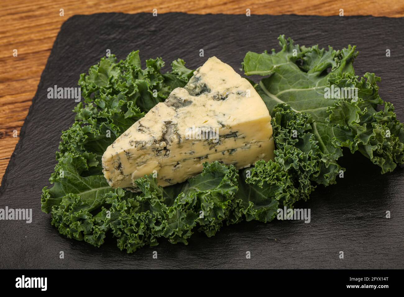 Dairy Blue cheese triangle with mold Stock Photo - Alamy