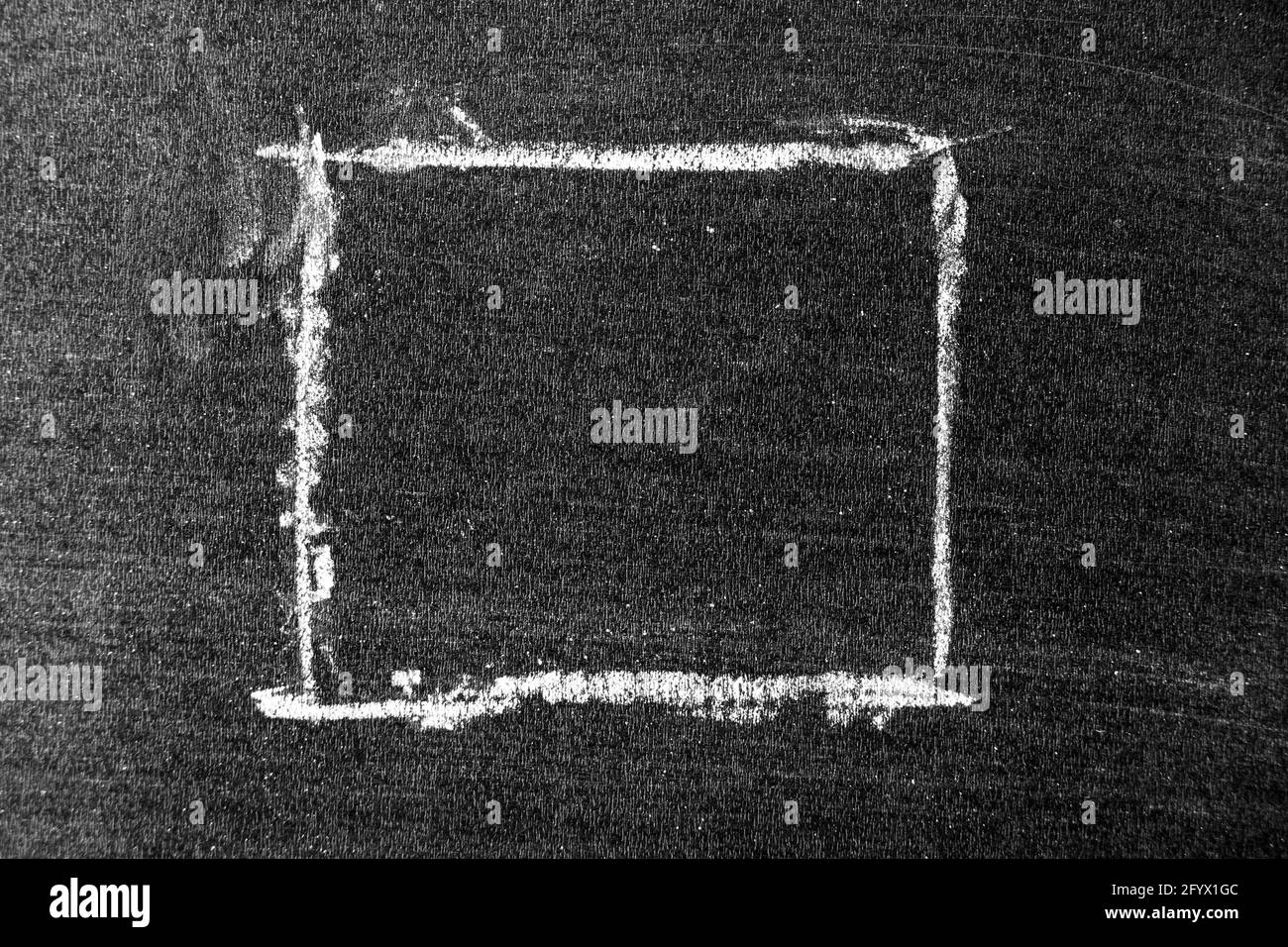 White chalk hand drawing in square or banner shape on black board ...
