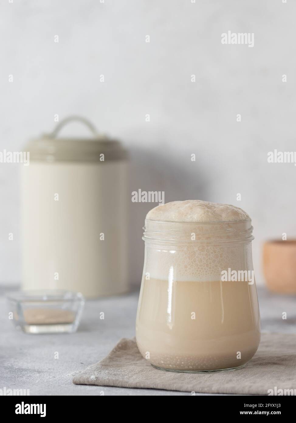 Active yeast fermentation in warm water. homemade baking. gray ...